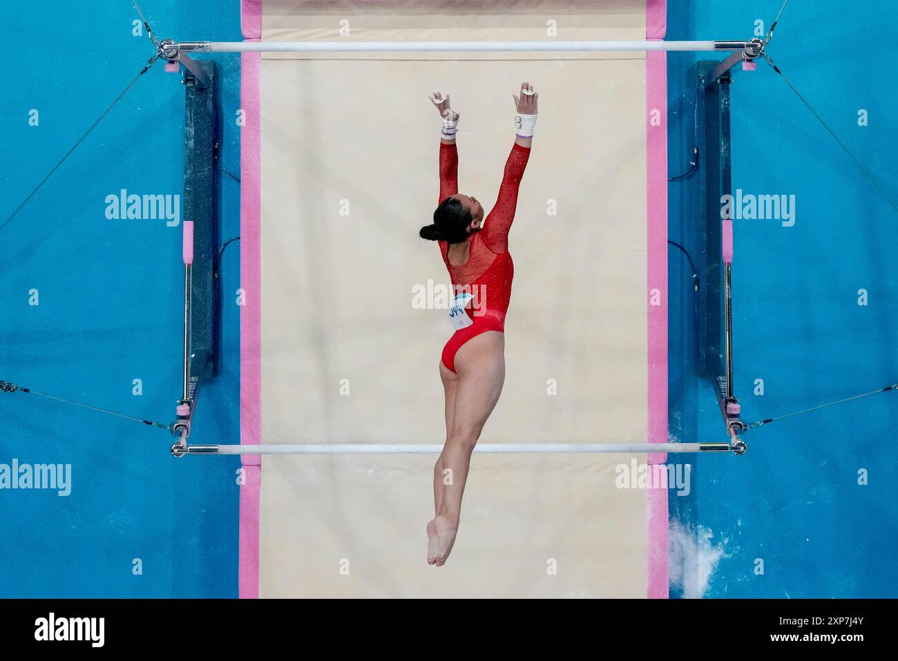 Suni Lee, of the United States, performs on the uneven bars during the ...