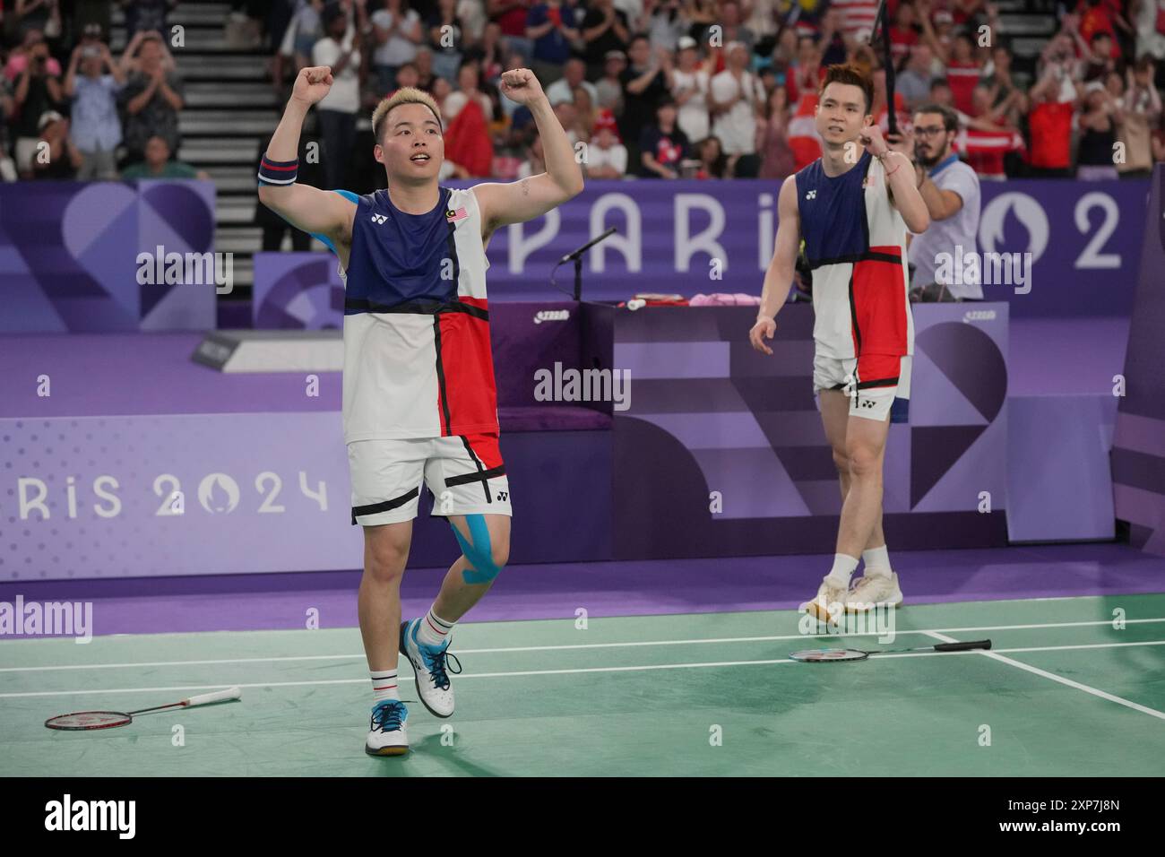Malaysia's Aaron Chia, left, and Soh Wooi Yik celebrate after defeating Denmark's Kim Astrup and ...