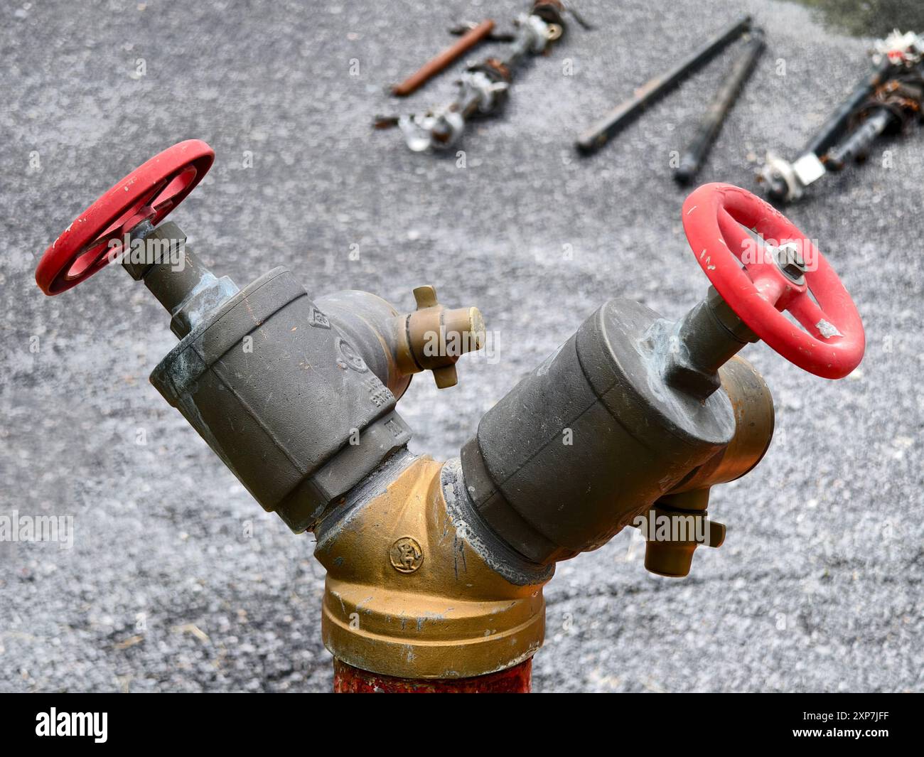 A detailed view of a fire hydrant with vibrant red handles Stock Photo ...