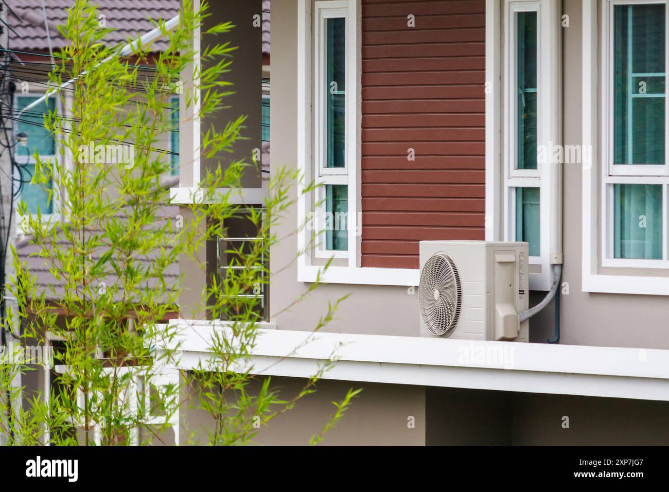 Air conditioner compressor outdoor unit installed outside the house ...