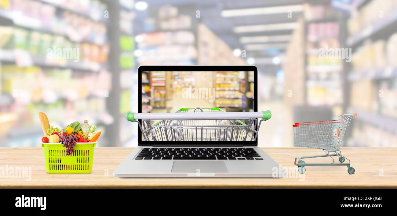 supermarket aisle blurred background with laptop computer and shopping ...