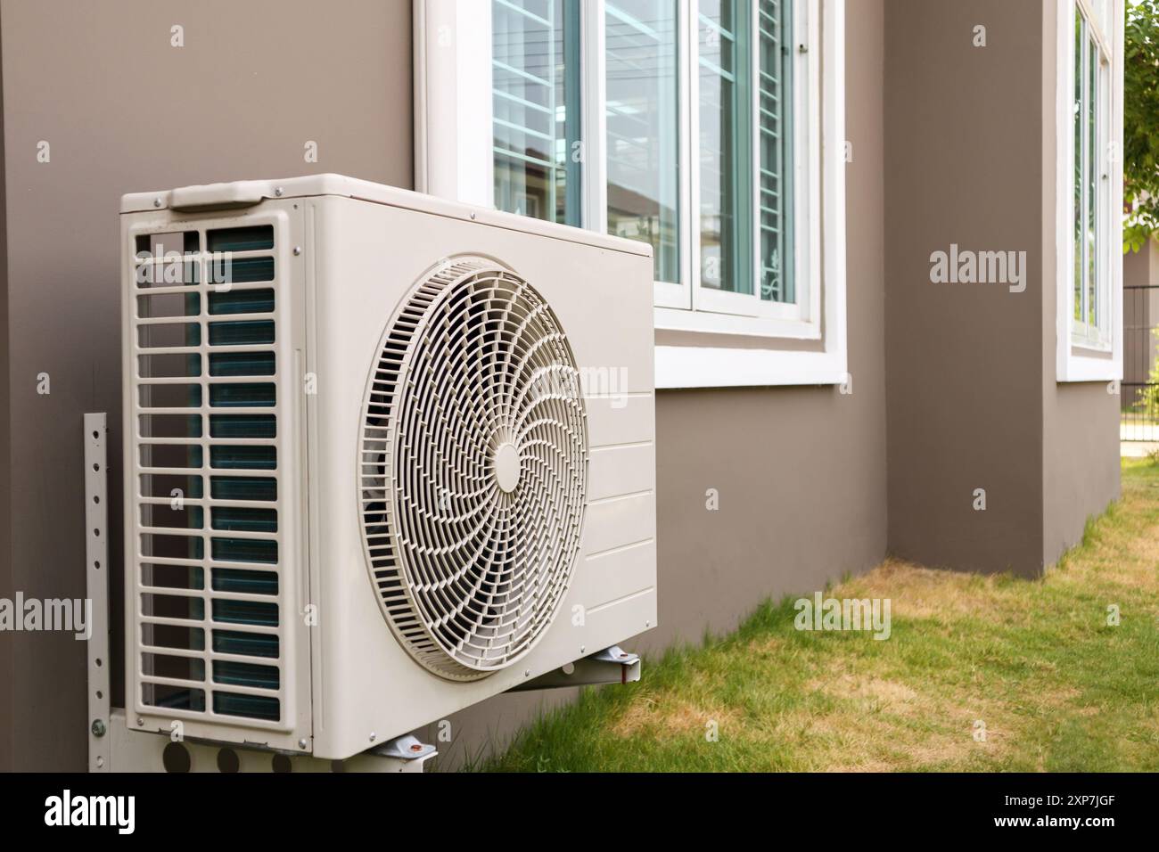Air conditioner compressor outdoor unit installed outside the house ...