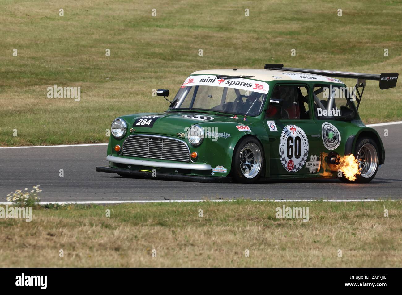 Driver Harvey Death (Green number 60) flare from his car during Track ...