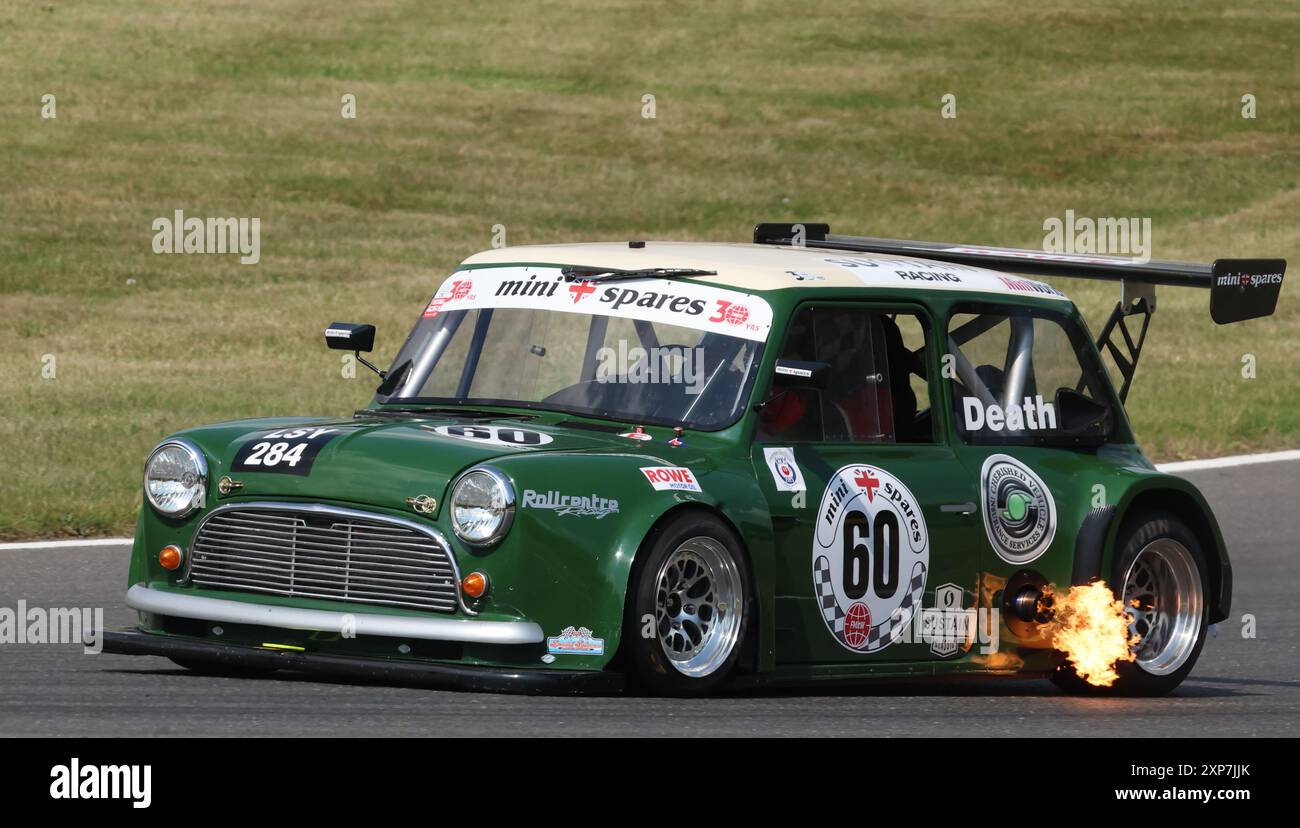 Driver Harvey Death (Green number 60) flare from his car during Track ...