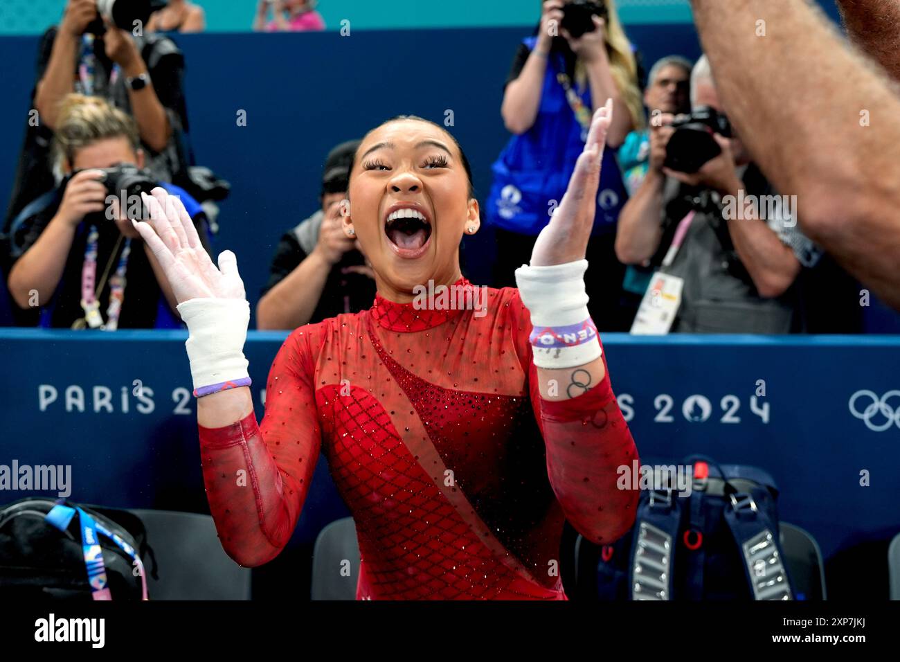 Suni Lee, of the United States, celebrates after winning the bronze ...