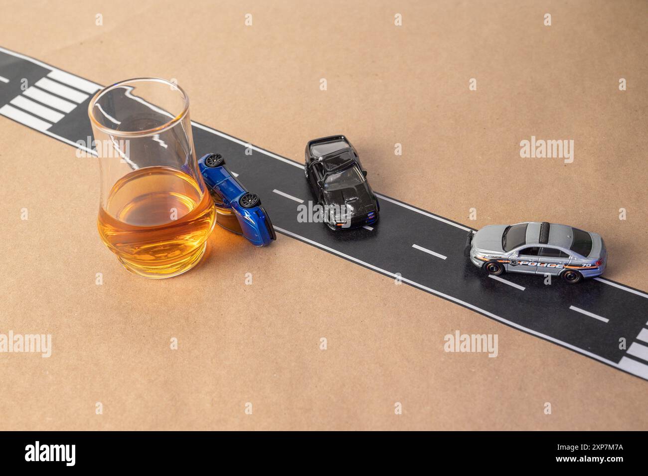 Don't drink and drive - traffic crash scene with model cars and bourbon ...