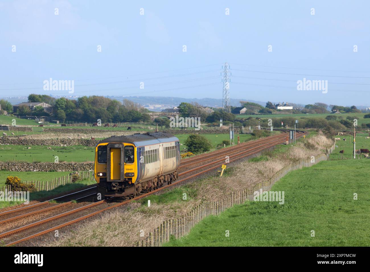 Northern Rail class 156 train 156481 passing Whitbeck on the rural scenic Cumbrian coast railway ...