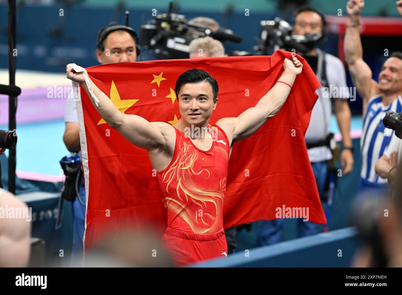 LIU Yang of China holding a national flag celebrates after winning the ...