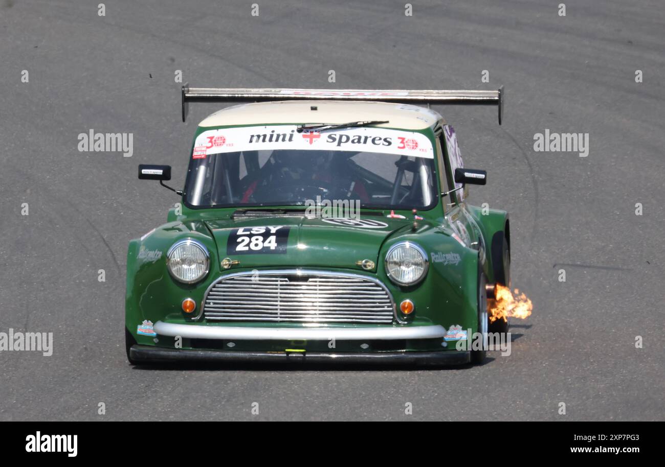 Driver Harvey Death (Green number 60) flare from his car during Track ...