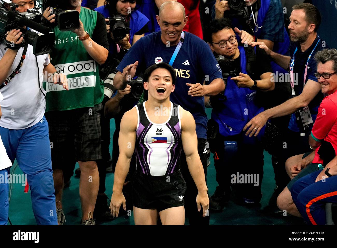 Carlos Edriel Yulo, of the Philippines, celebrates after winning the ...
