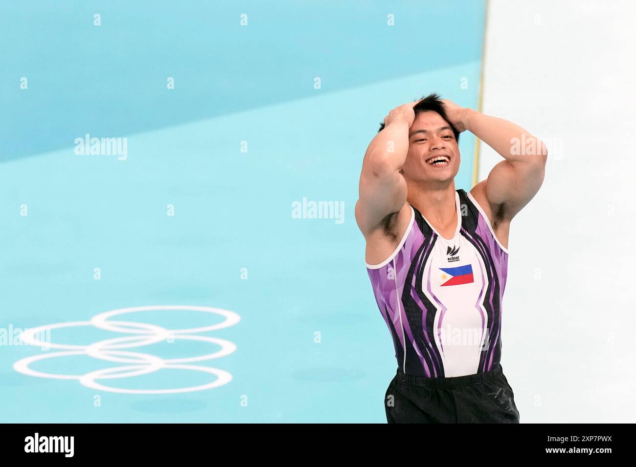 Carlos Edriel Yulo, of the Philippines, celebrates after winning the ...