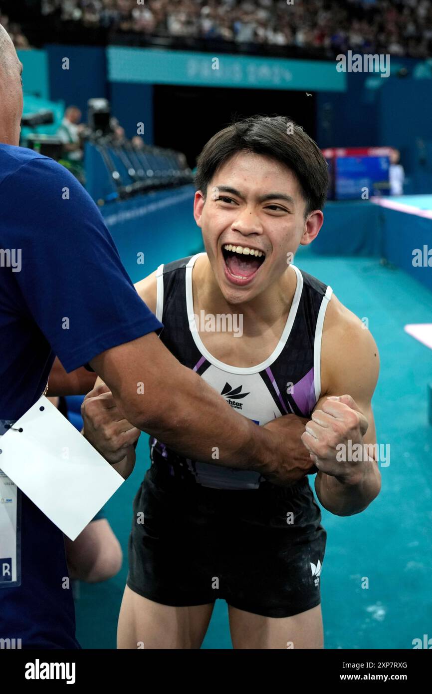 Carlos Edriel Yulo, of the Philippines, celebrates after winning the ...