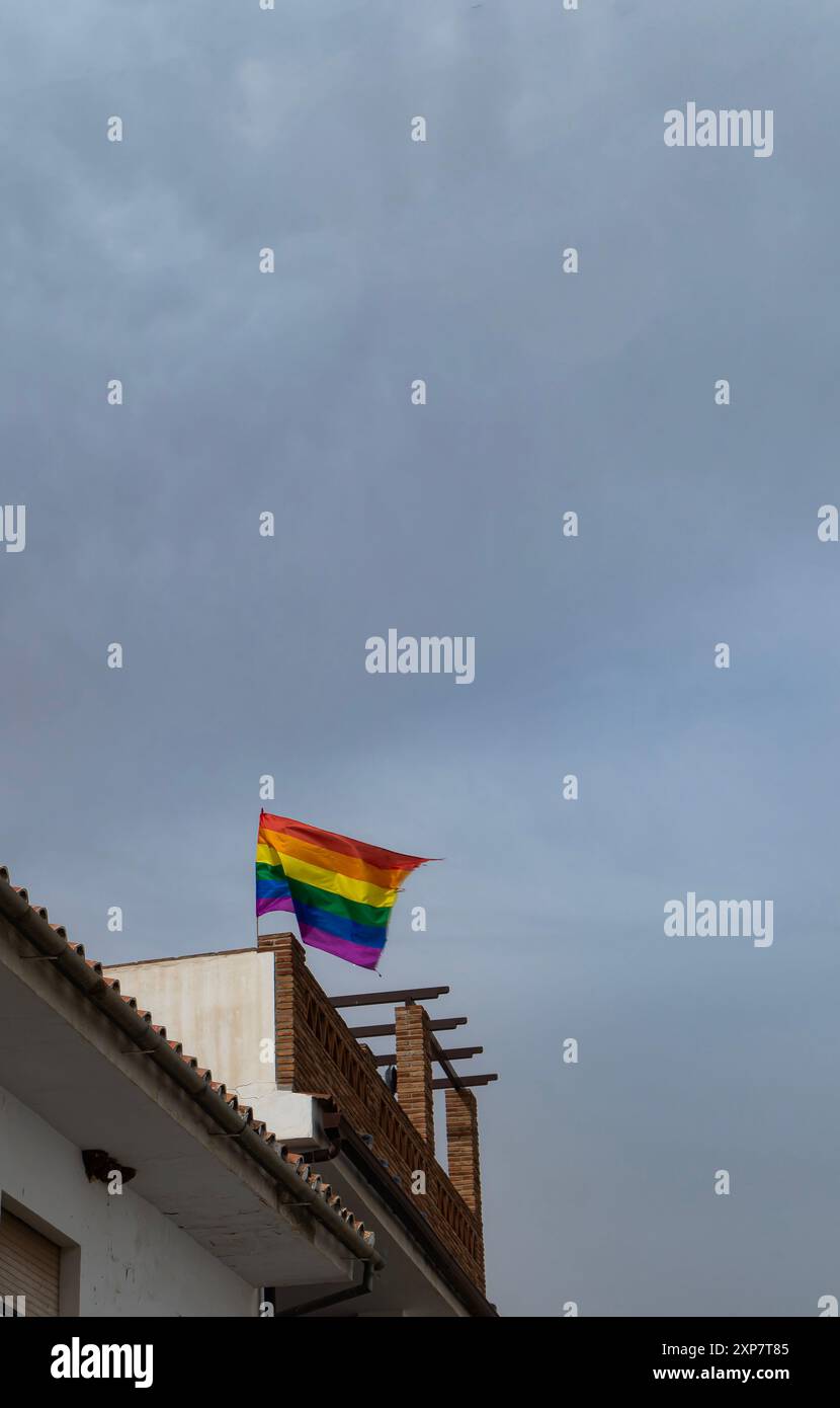 Rainbow lgtbi flag placed on the terrace of a house in an Andalusian ...
