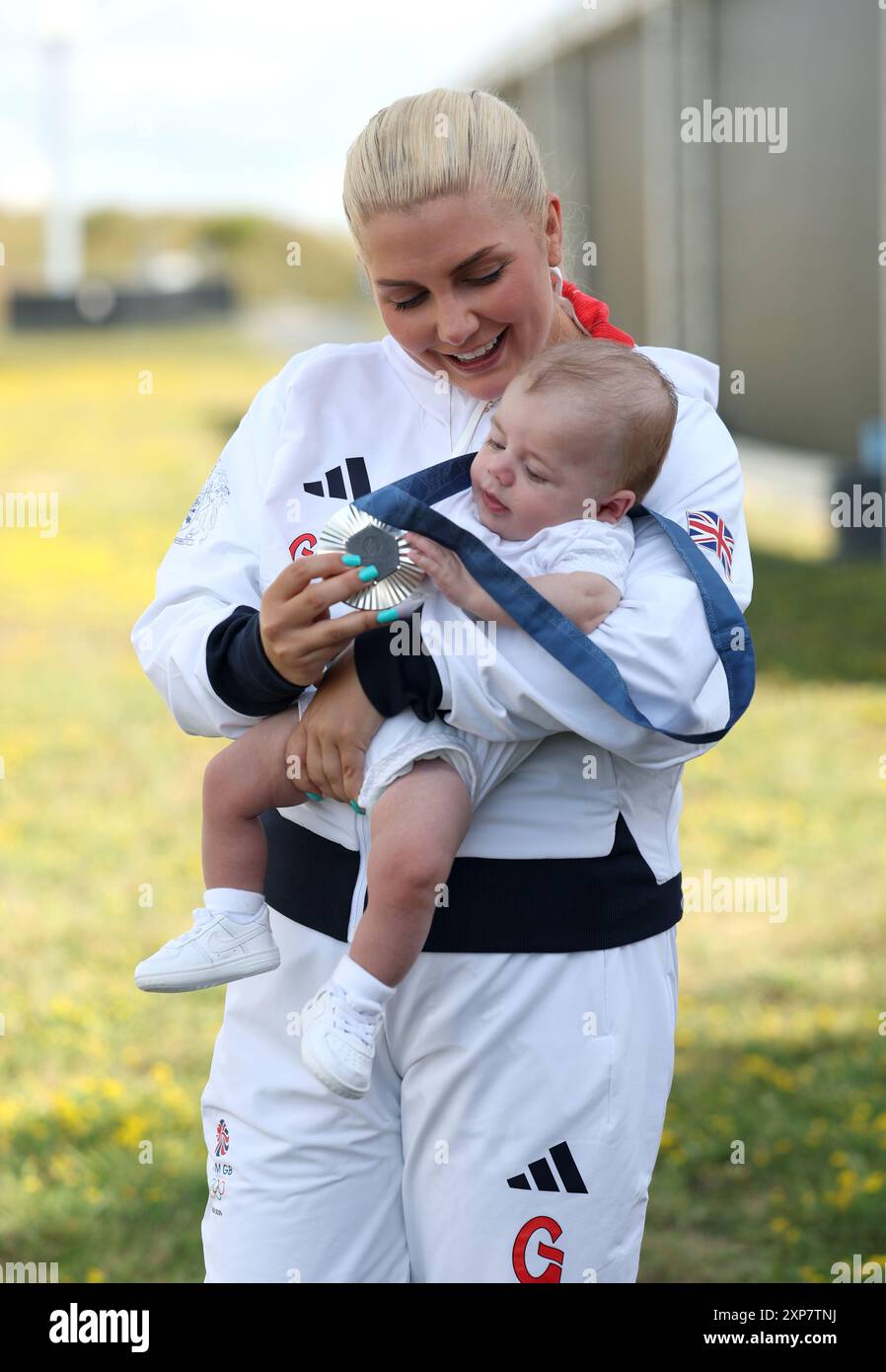 Great Britain's Amber Rutter poses with son Tommy and the silver medal ...