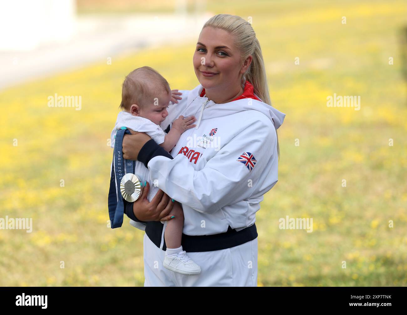 Great Britain's Amber Rutter poses with son Tommy and the silver medal ...