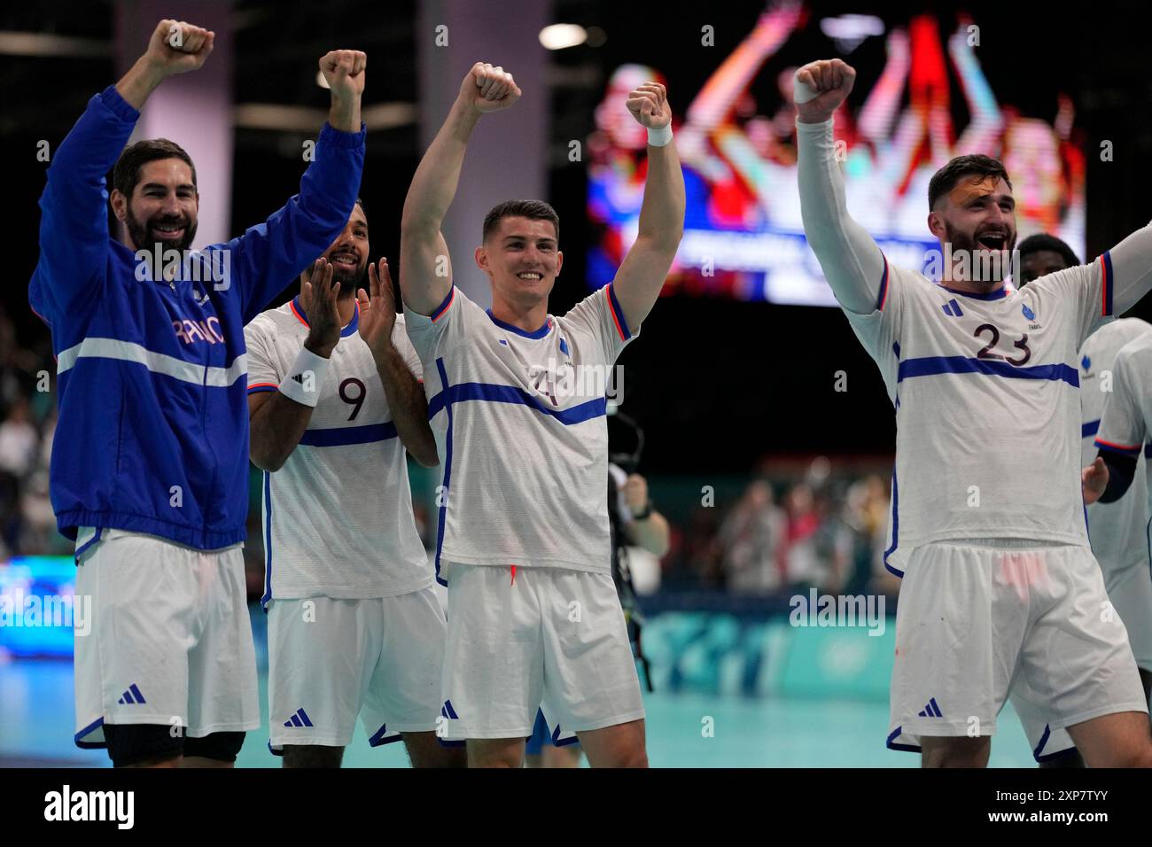French team celebrates after winning against Hungary during a men's ...