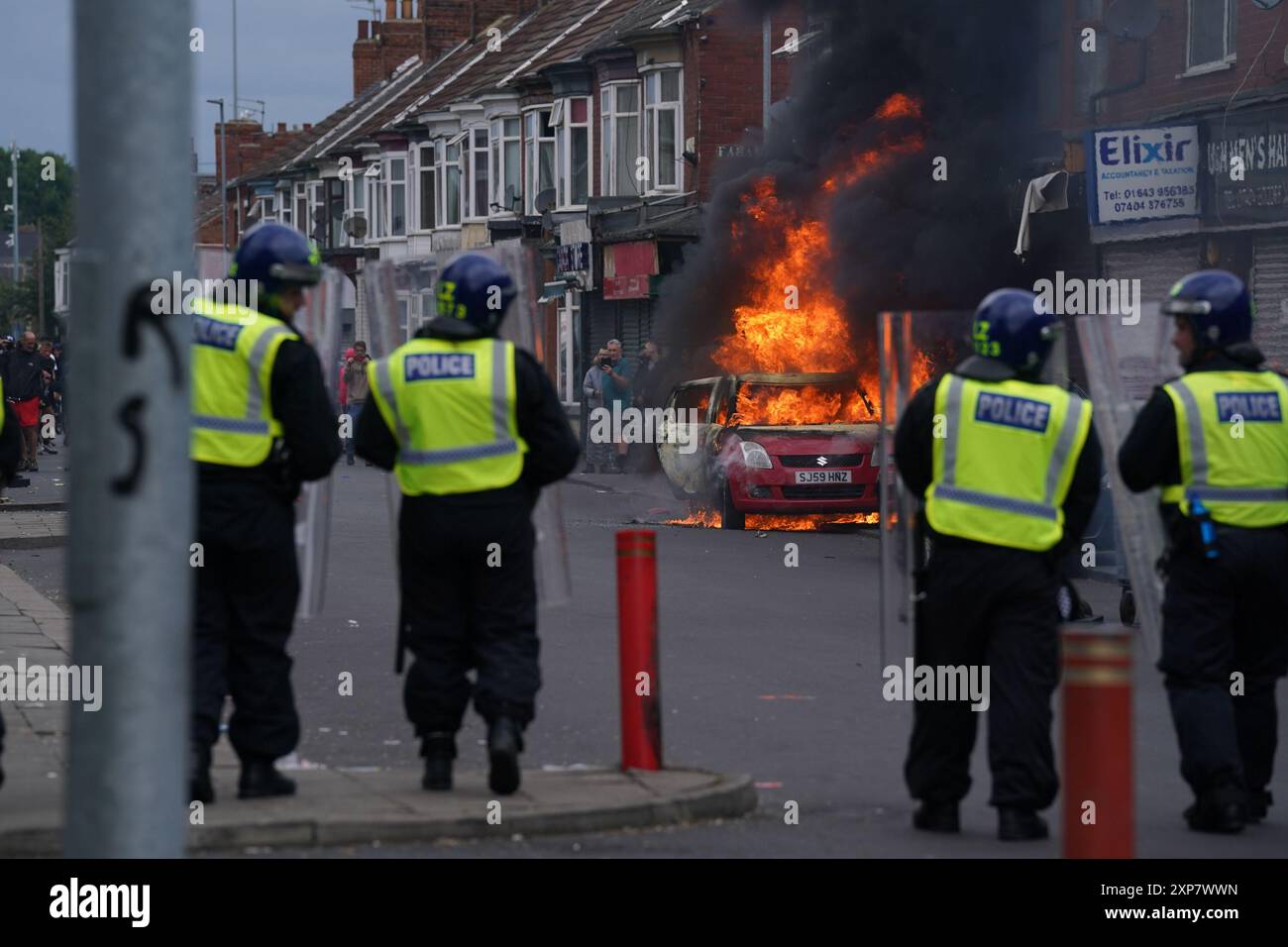 A car burns during an anti-immigration protest in Middlesbrough ...