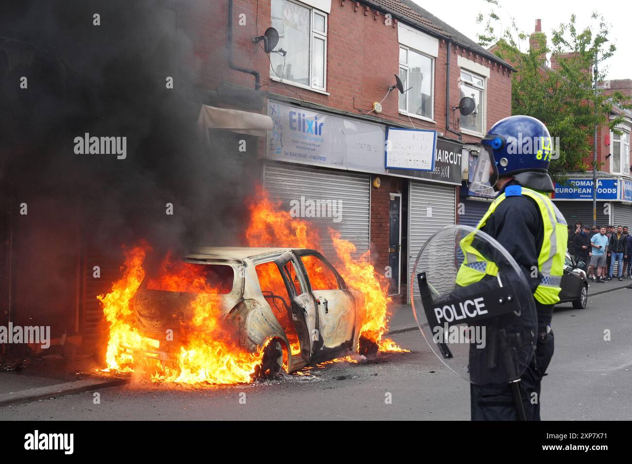 A car burns on Parliament Road, in Middlesbrough, during an anti ...