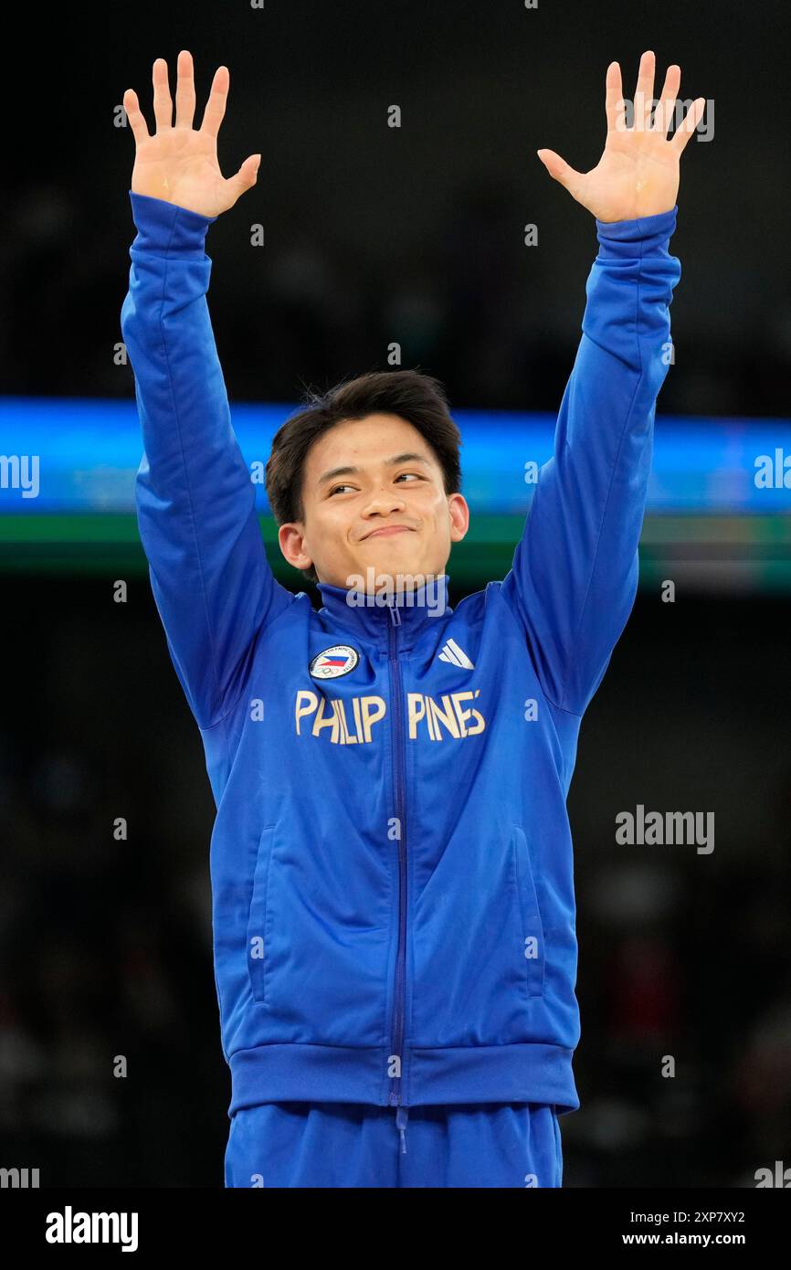 Carlos Edriel Yulo, of the Philippines, celebrates on the podium after ...