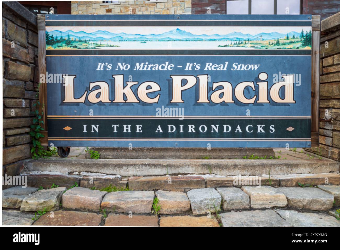 A vibrant blue sign proudly marks Lake Placid in the heart of the ...