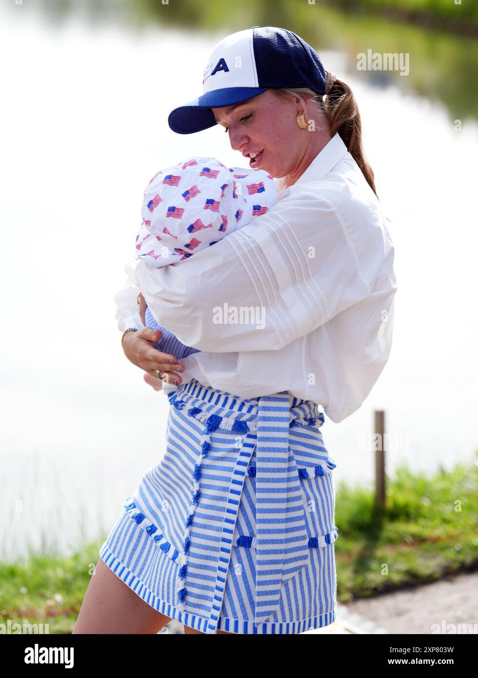Meredith Scudder, wife of Scottie Scheffler, cradles her son, Bennett ...