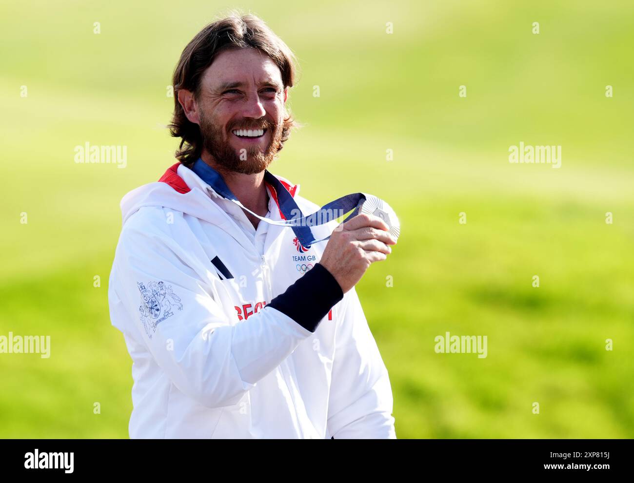 Great Britain's Tommy Fleetwood with his silver medal following the Men ...