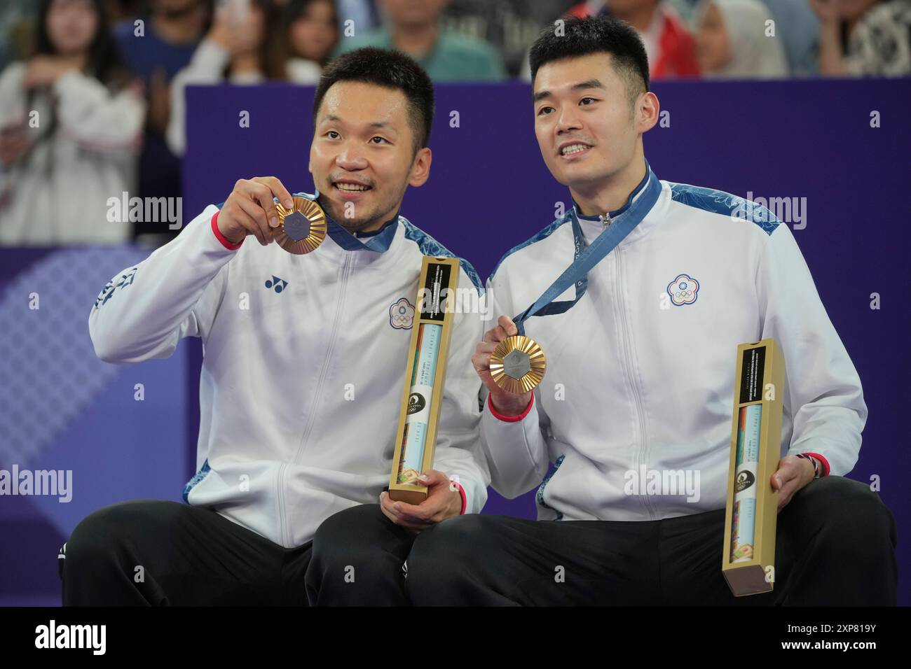 Gold medalists, Taiwan's Lee Yang, left, and Wang Chi-Lin celebrate on ...