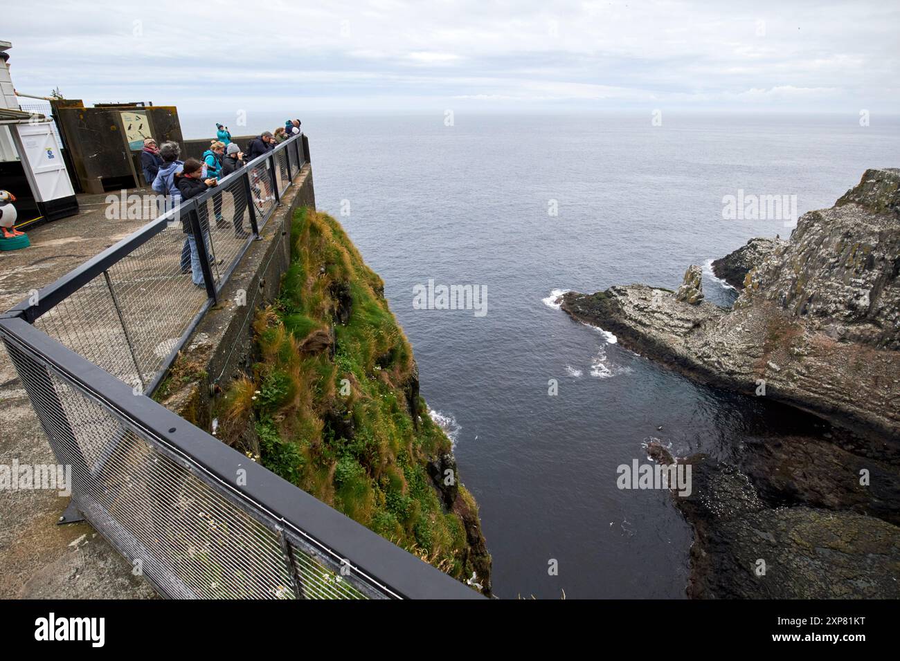 tourists looking through binoculars at rspb centre rathlin west light ...