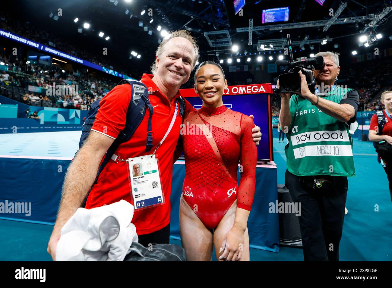 Sunisa Lee of United States and Jess Graba, head coach of Sunisa Lee ...