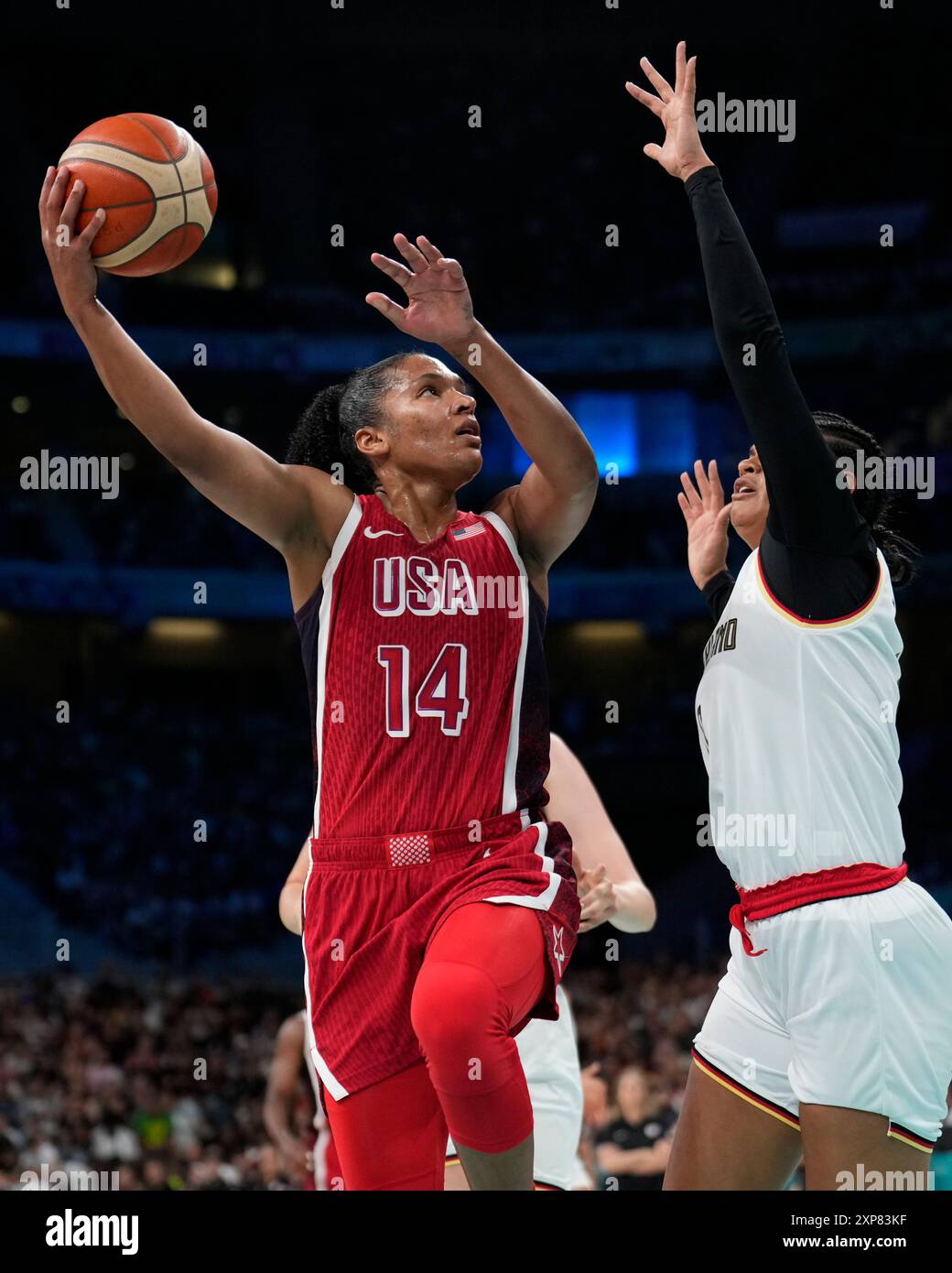 Alyssa Thomas (14), of the United States, shoots over Satou Sabally (0 ...