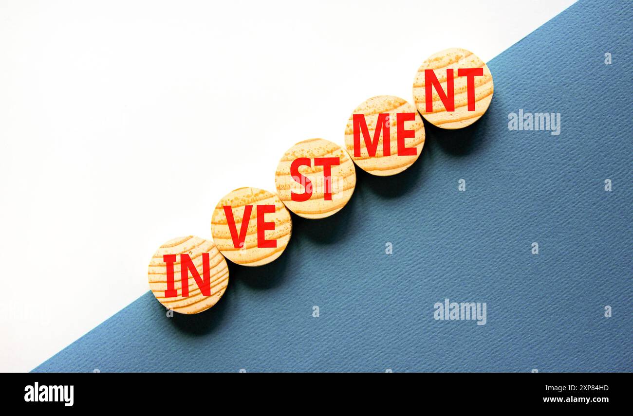 Investment symbol. Concept word Investment on beautiful wooden circles ...