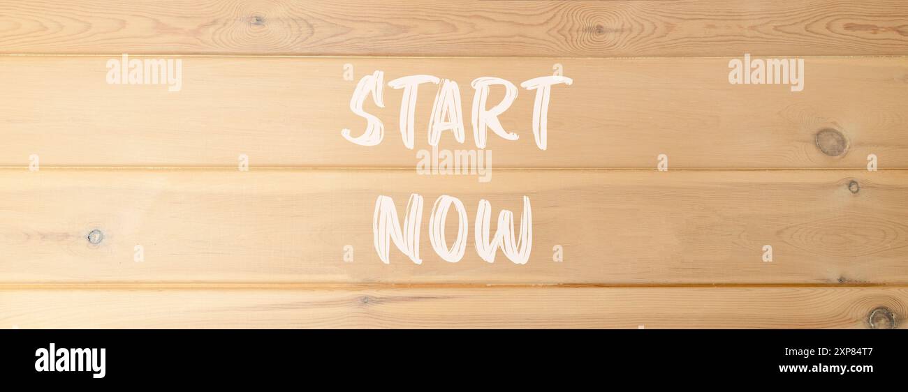 Start now symbol. Concept words Start now on beautiful wooden wall ...