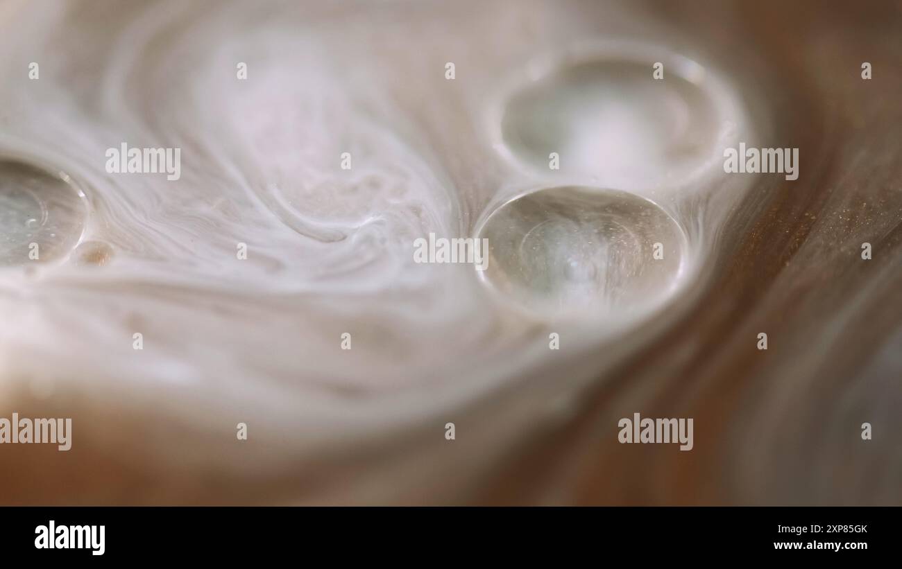 Glitter emulsion. Paint bubbles. Blur white brown golden color ...