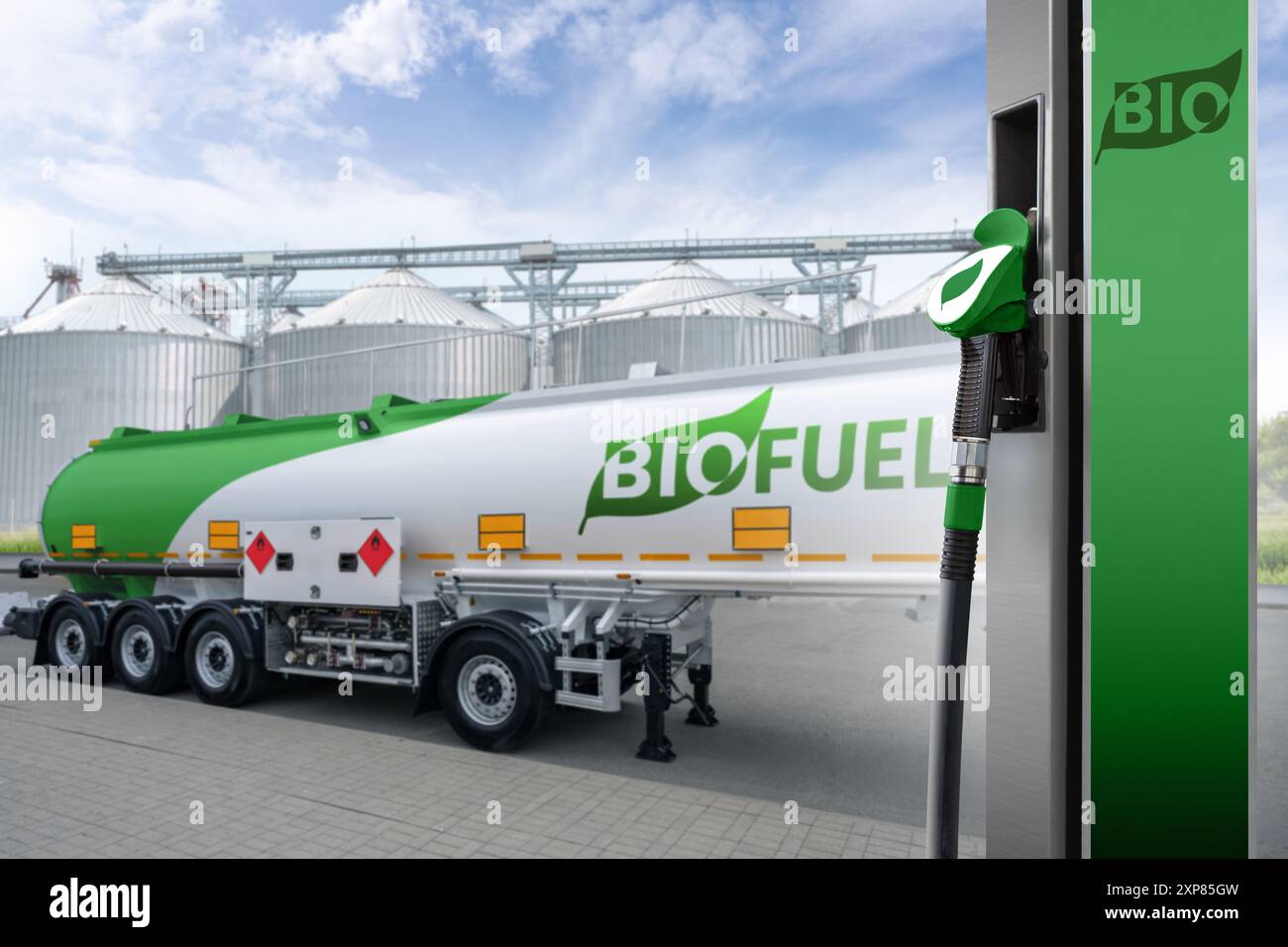 Fuel nozzle with inscription BIO on a background of tank trailer with ...