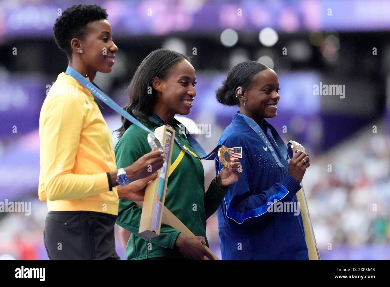 Women's triple jump gold medalist Thea Lafond, center, of Dominica ...
