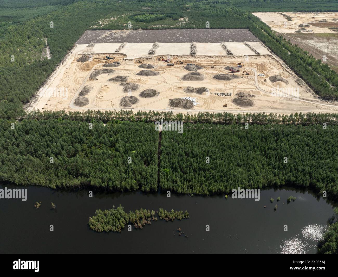 Quarrying sand. Machines and truck working on sand mine. Mining quarry ...