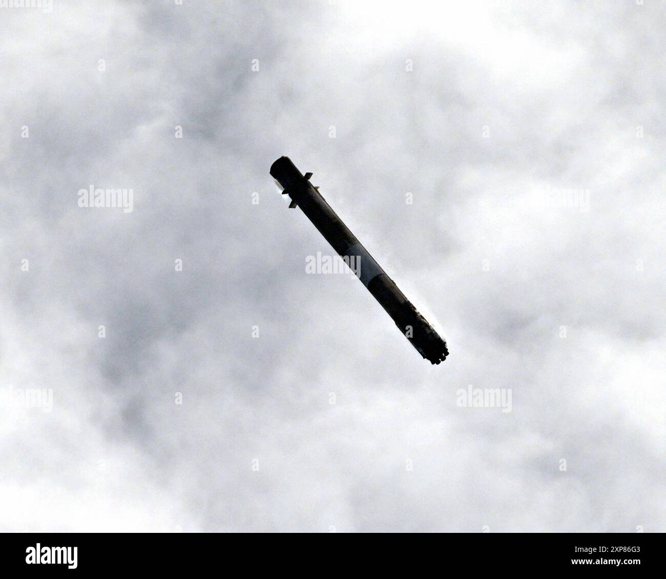 A SpaceX Falcon 9 rocket returns to Landing Zone 1 after launching the ...