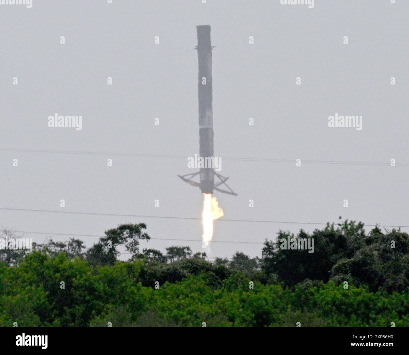 A SpaceX Falcon 9 rocket returns to Landing Zone 1 after launching the ...