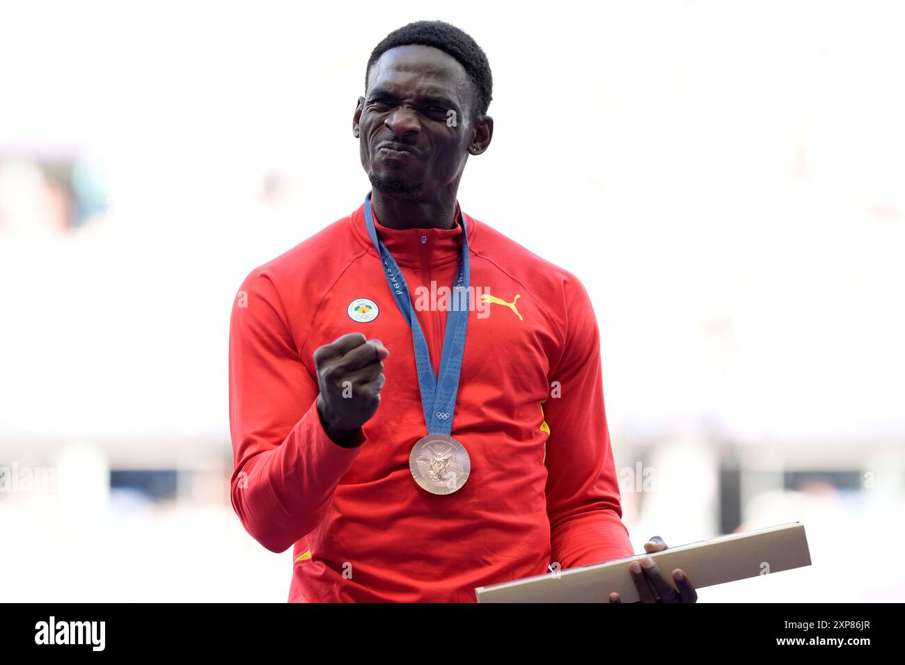 Decathlon bronze medalist Lindon Victor, of Grenada, reacts on the ...