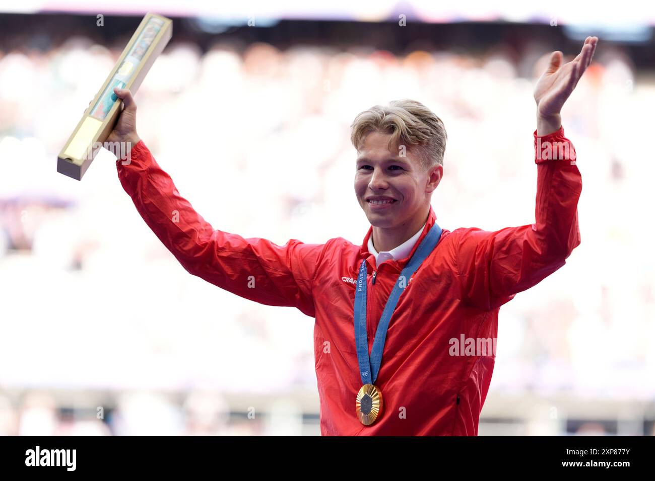 Decathlon gold medalist, Markus Rooth, of Norway, waves on the podium ...