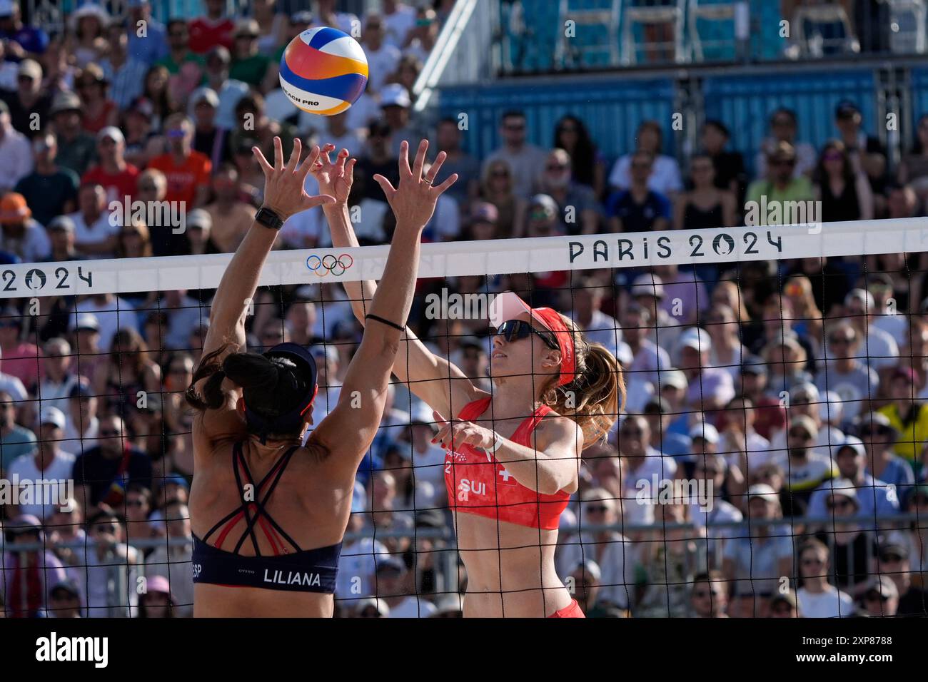 Switzerland's Nina Brunner hits over Spain's Liliana Fernandez Steiner ...