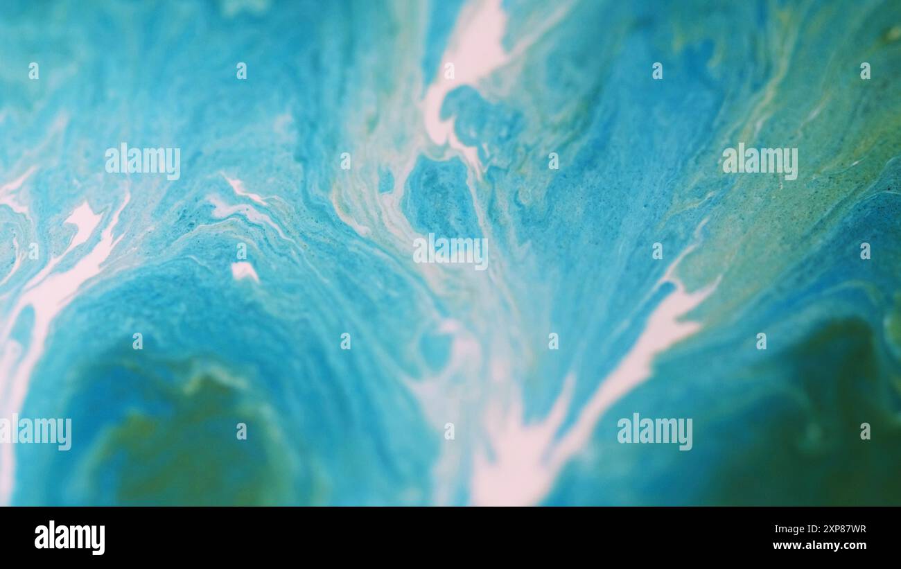 Sparkling flow. Wet shimmering texture. Blue green paint defocused mix ...