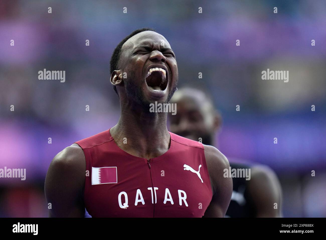 Ammar Ismail Yahia Ibrahim, of Qatar, reacts after competing in a heat ...