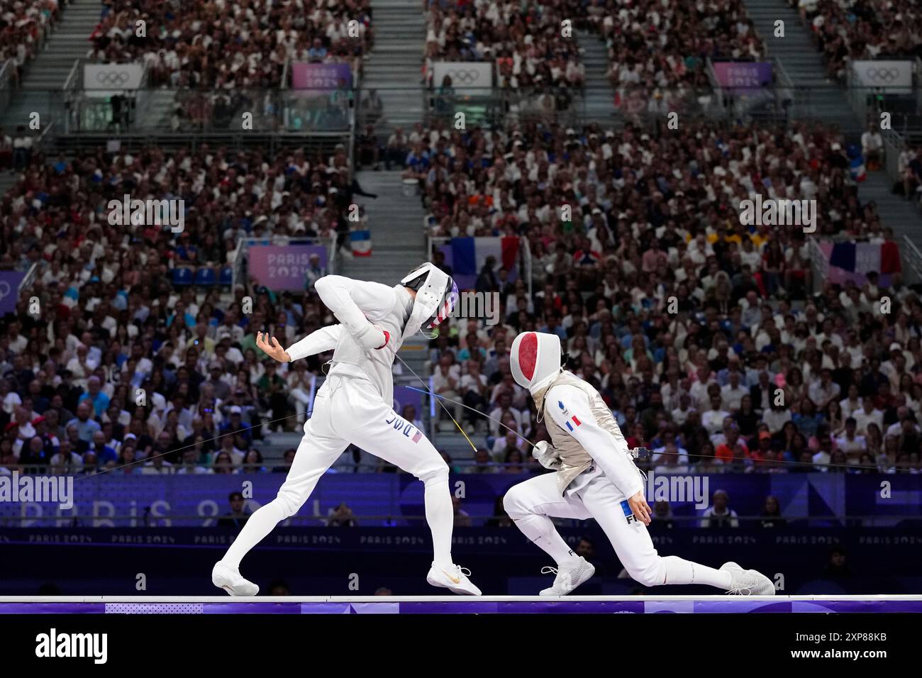 United State's Nick Itkin competes with France's Maxime Pauty in the ...