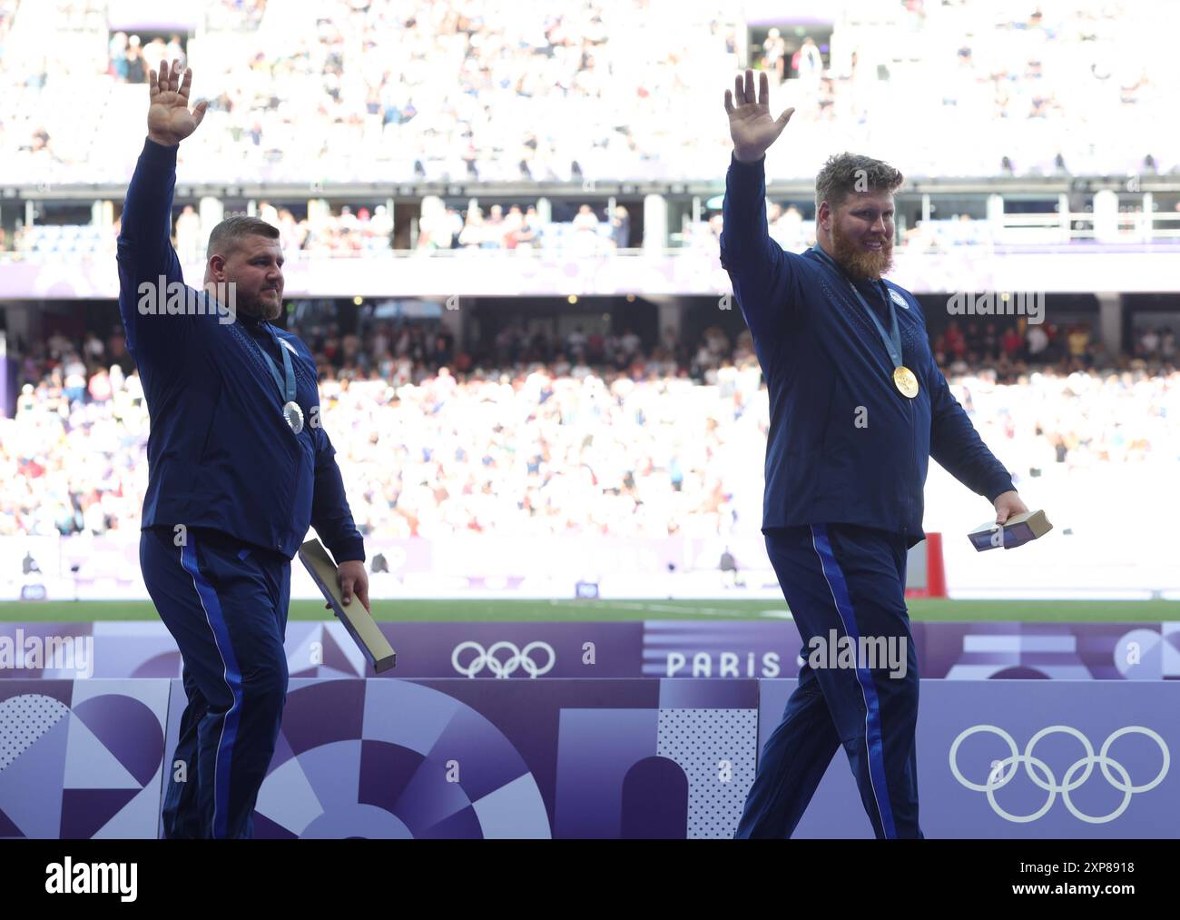 Paris, France. 04th Aug, 2024. Men's Shot Put gold medalist Ryan Crouser of the U.S. (R) and ...