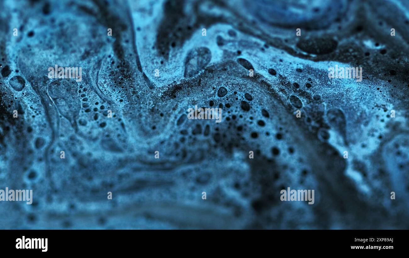 Oil fluid. Shimmering paint spill. Defocused sparkling blue ink water ...
