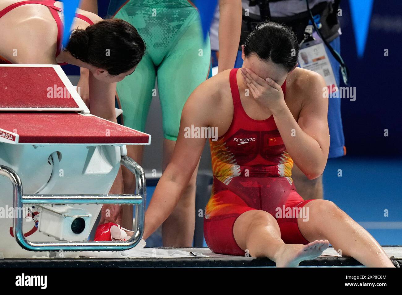 China's Yang Junxuan reacts after finishing third in the women's 4x100-meter medley relay final ...
