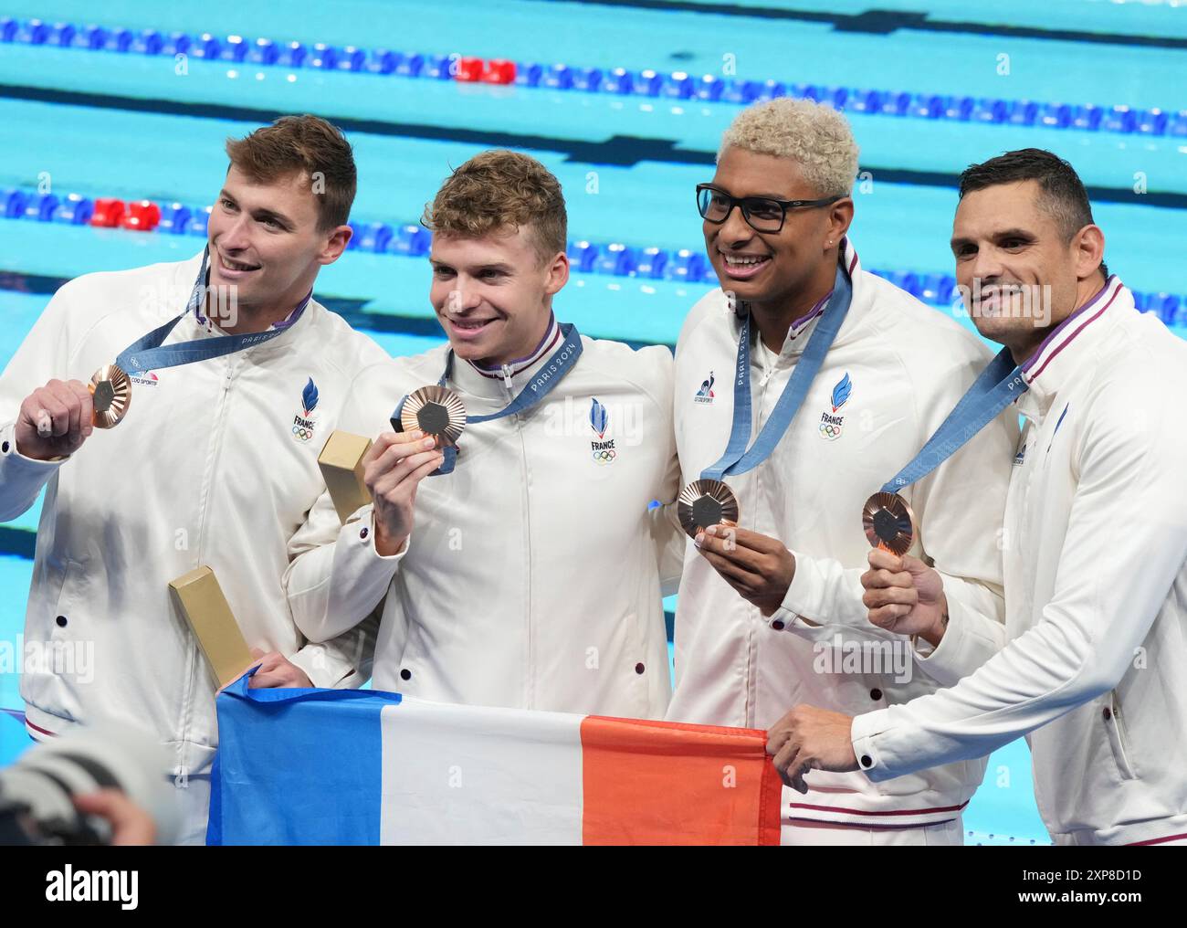 Members of France celebrate during the swimming men's 4 x 100m medley ...