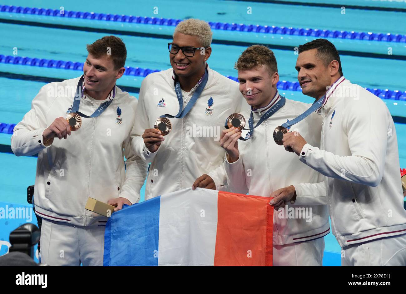 Members of France celebrate during the swimming men's 4 x 100m medley ...