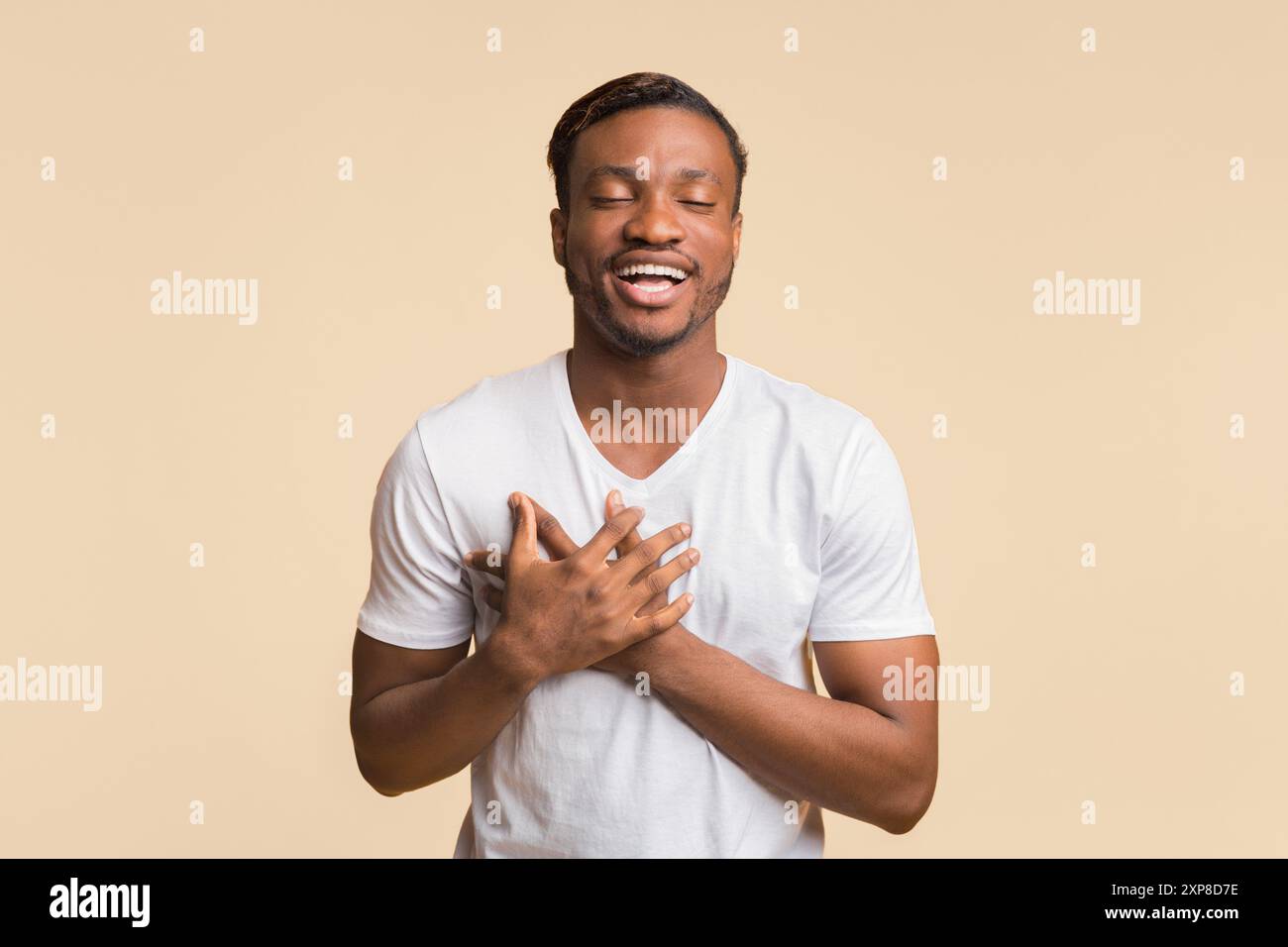 Touched Black Man Pressing Hands To Chest Standing, Yellow Background ...